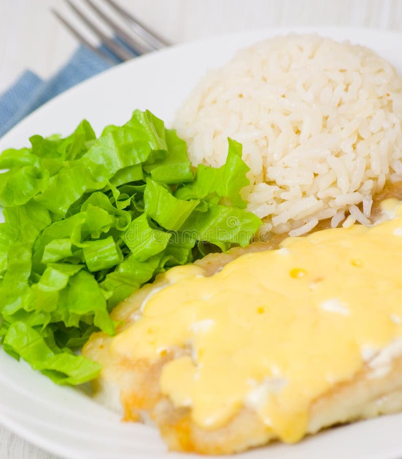 Fish Fillet Under Cheese with Rice and Salad Stock Image - Image of ...