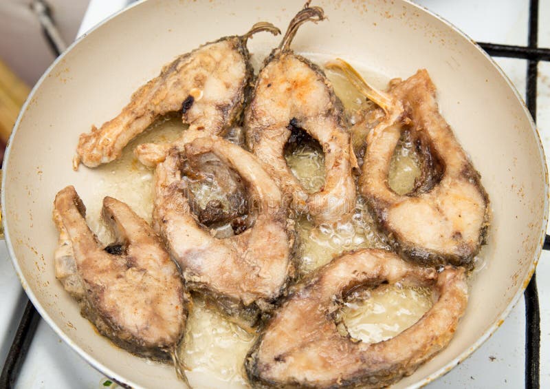 Fish fried in a pan stock image. Image of cooking, prepared - 101157073