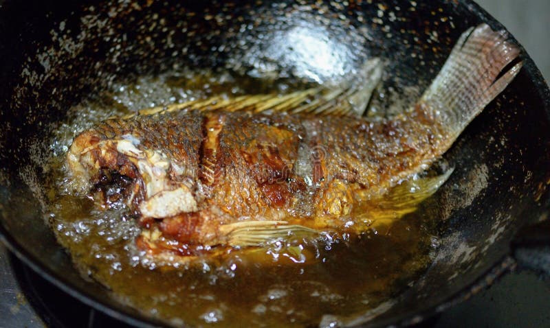 Fish Frying in a Pan in the Outdoors Stock Photo - Image of tasty ...