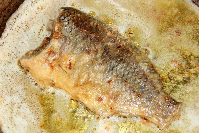 Fish frying in pan stock photo. Image of frying, fishery - 70267048