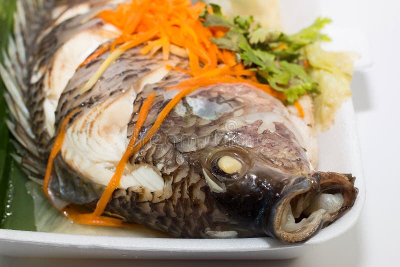 A Steamed Tilapia Fish Garnish with Vegetables Stock Image - Image of ...