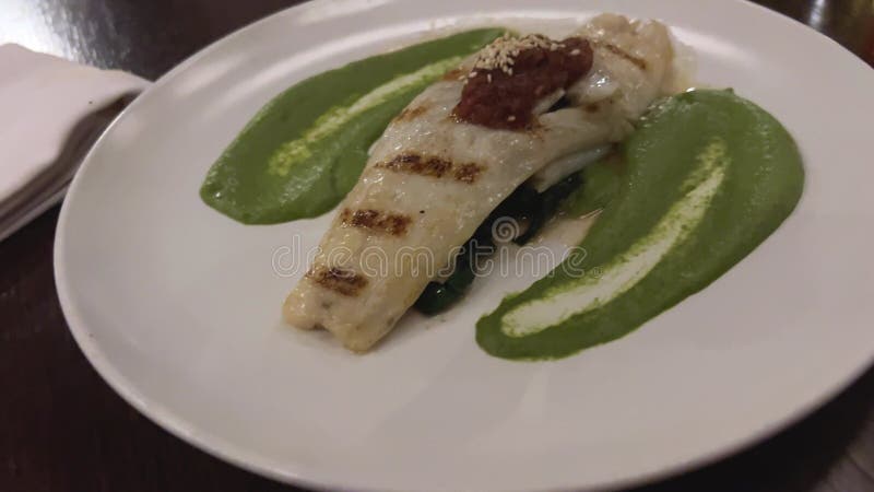 A Piece of White Fish with Green Pea Puree Stock Video - Video of ...