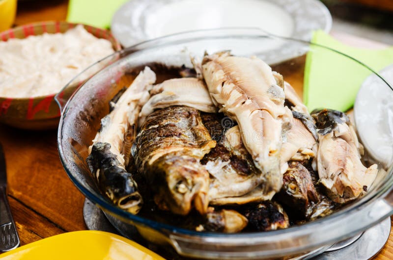 Traditional Romanian Meal: Mamaliga with Fish Stock Photo - Image of ...