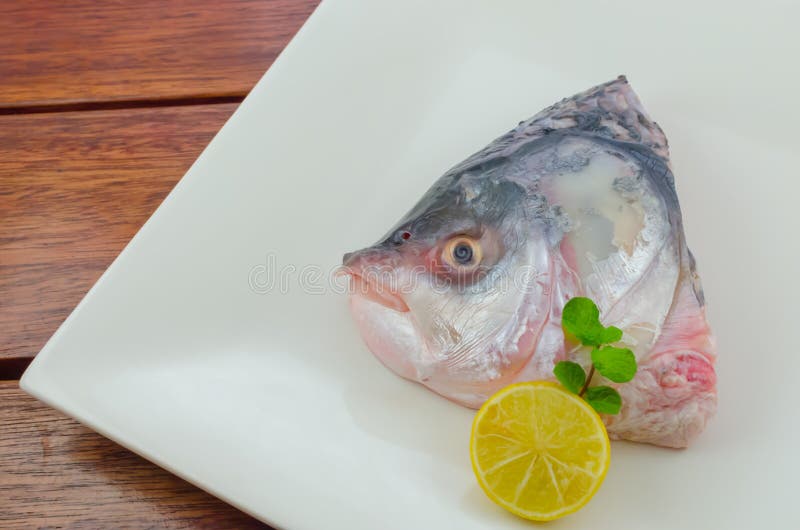 Fish head stock photo. Image of herbs, sprigs, white - 58452994