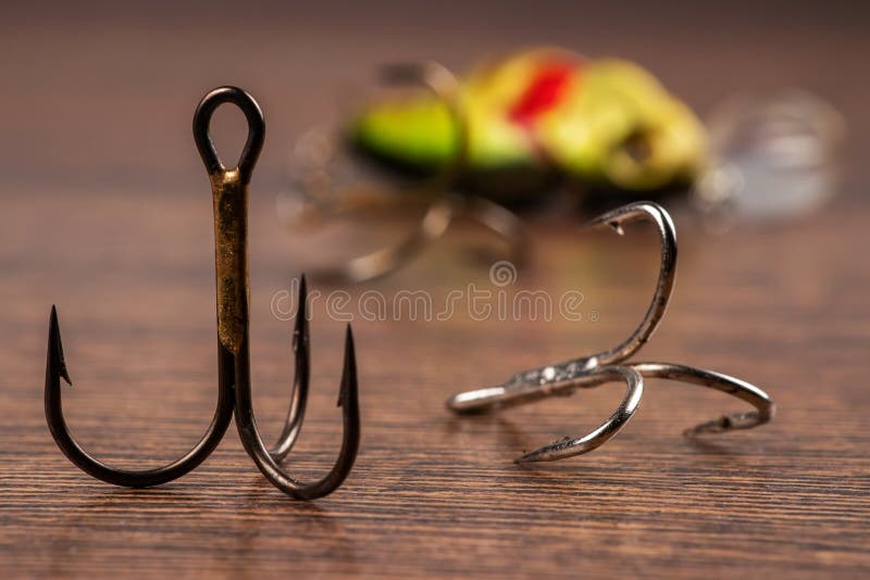 Fish Hooks with 3 Hooks and Bait on a Wooden Background Stock Image ...