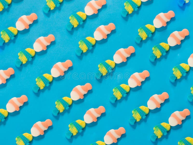 Fish Jelly Candies Kissing Pattern on Green Stock Photo - Image of ...