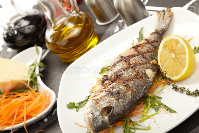 Fish with lemon stock image. Image of dining, rosemary - 18778783