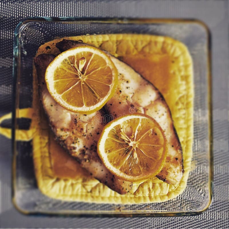 Fish with lemons stock photo. Image of yellow, delicious - 161610498