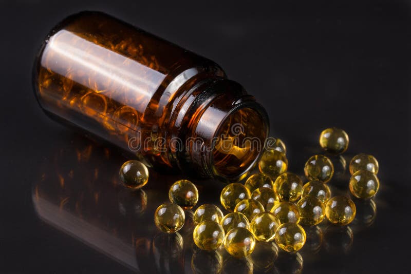 Fish Oil Capsules in a Glass Bottle Isolated on White Background Stock ...