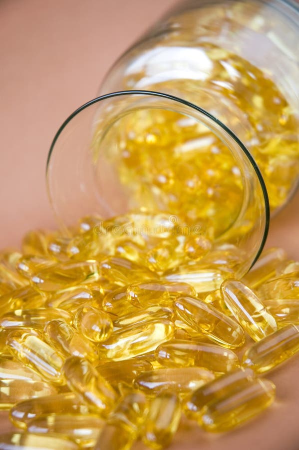 Fish Oil Spill Out from Bottle Stock Photo - Image of pills, illness ...