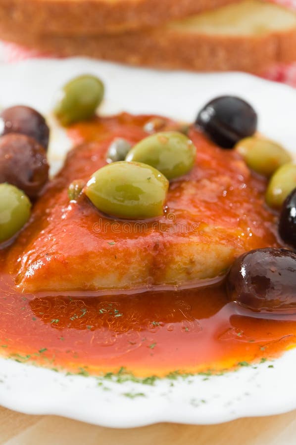 Fish with Olives in Tomato Sauce. Stock Photo - Image of hake ...