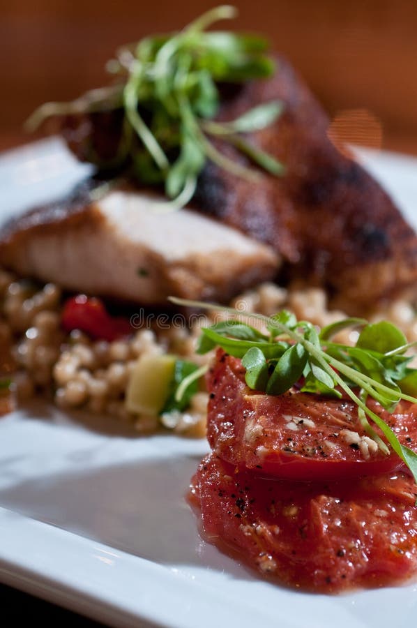 Fish over couscous stock photo. Image of dining, kingfish - 16552734