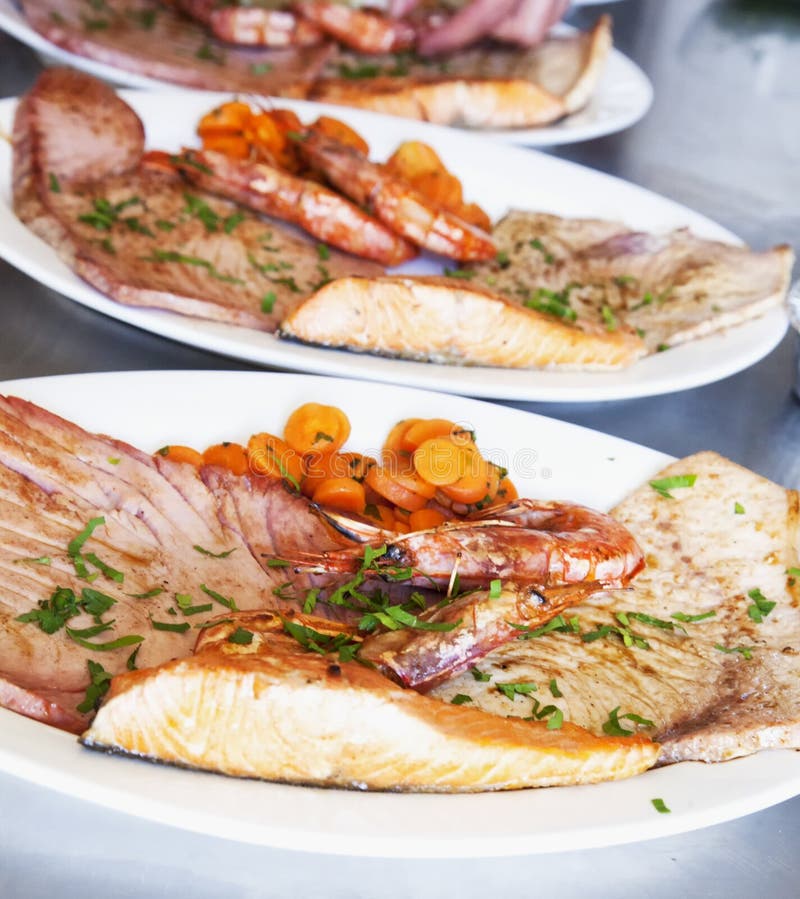 Fish over plates stock photo. Image of baked, fried, plate - 70651140