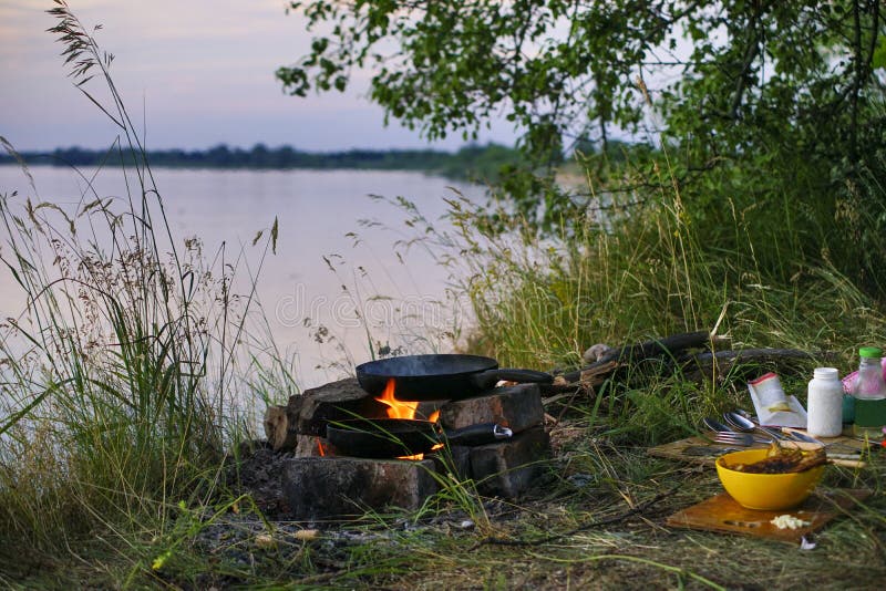 Fish in a Pan is Fried on a Fire on the River Bank. Stock Image - Image ...