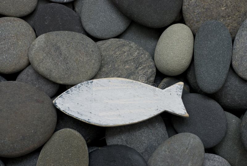 Fish on pebble stock photo. Image of symbol, detail, white - 14077706