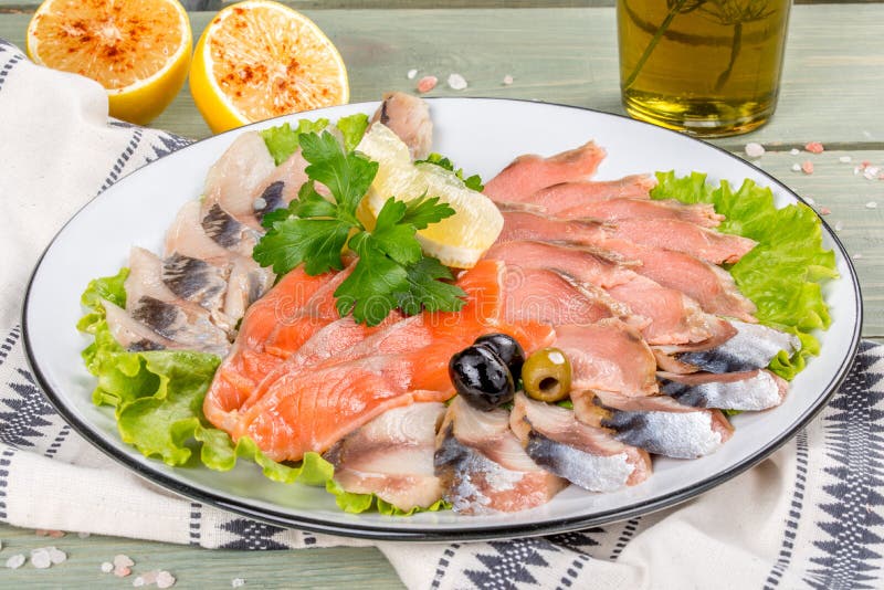 Fish Plate with Different Types of Smoked and Salted Fish Stock Photo ...