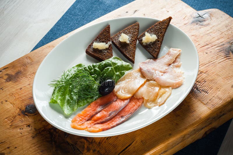 Fish Platter on a Large White Plate Stock Photo - Image of setting ...