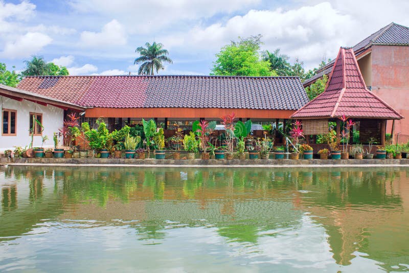 Fish pond front restaurant stock image. Image of java - 268289217