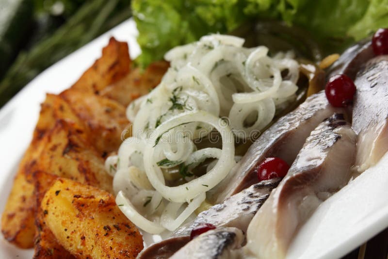 Fish with potato stock image. Image of potato, onion - 25890417
