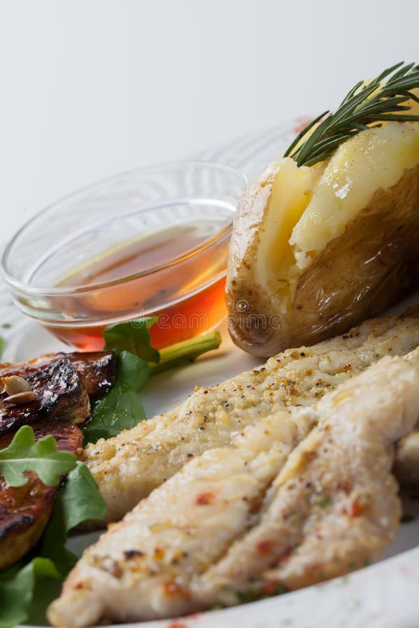 Fish and potatoes stock image. Image of grilled, cutlery - 25493781