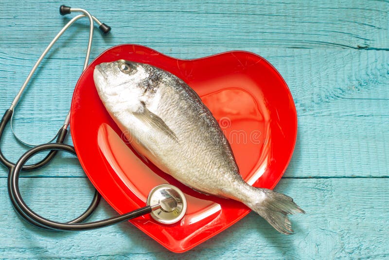 Fish on Red Heart Plate and Stethoscope Stock Image - Image of ...