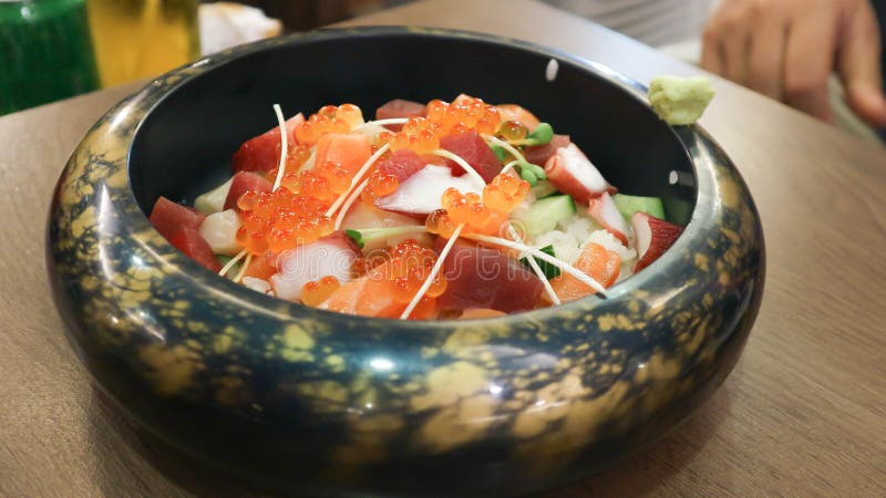 Bowl Of Mixed Raw Fish On Rice With Egg And Vegetable Stock Photo ...