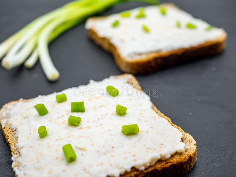 Fish Roe Paste Spread on Bread Slices and Green Onion on Slate ...
