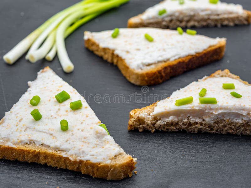 Fish Roe Paste Spread on Bread Slices and Green Onion on Slate ...