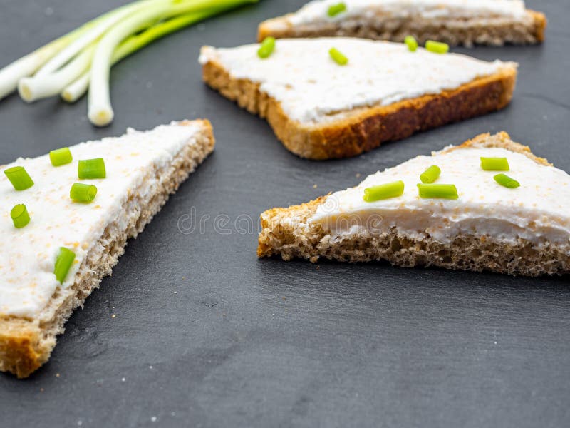 Fish Roe Paste Spread on Bread Slices and Green Onion on Slate ...