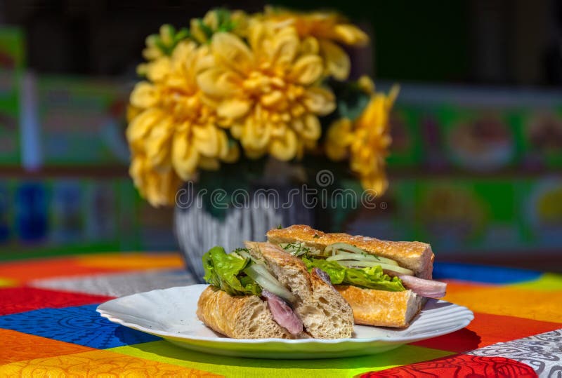 A Fish Roll on a Plate in Front of a Takeaway. Stock Image - Image of ...