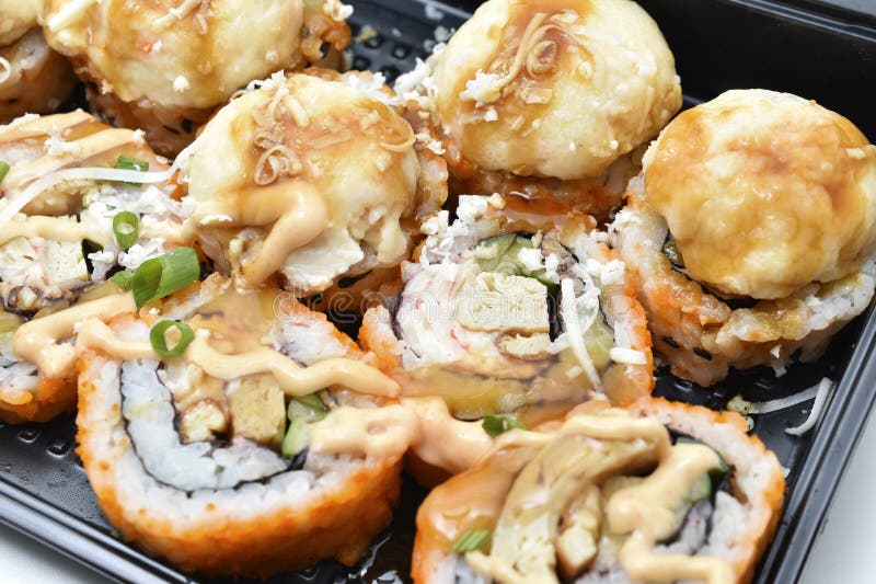 Fish Rolls on a Black Backing. Rice Snack Stock Photo - Image of ...