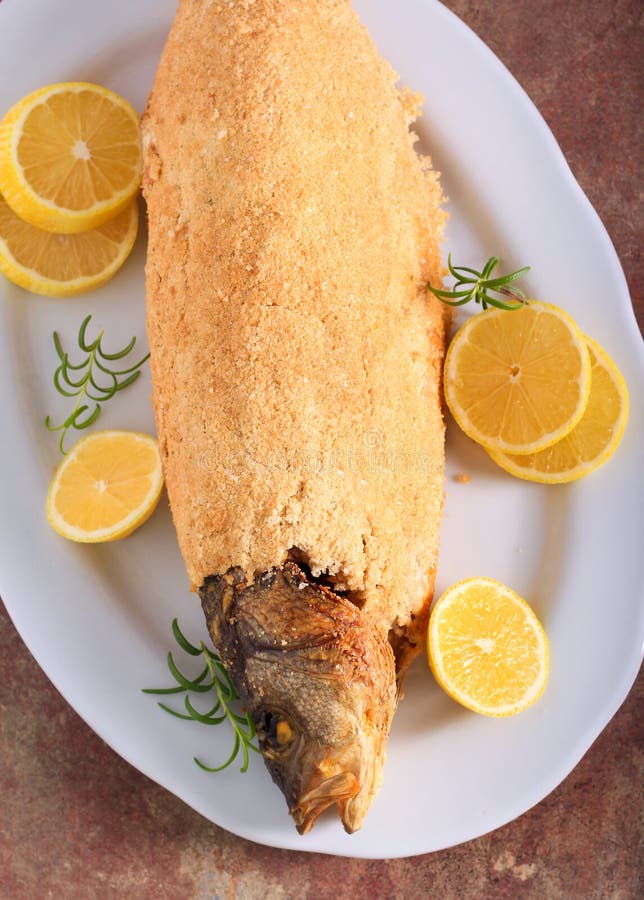 Fish in Rosemary and Lemon Scented Salt Stock Photo - Image of roast ...