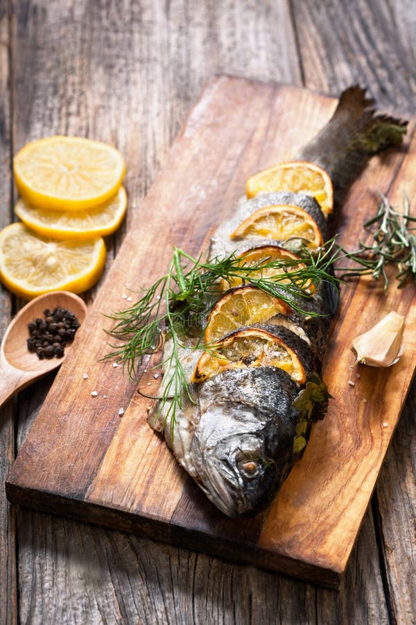 Fish on Rustic Table with Fresh Ingredients for Cooking Stock Photo ...