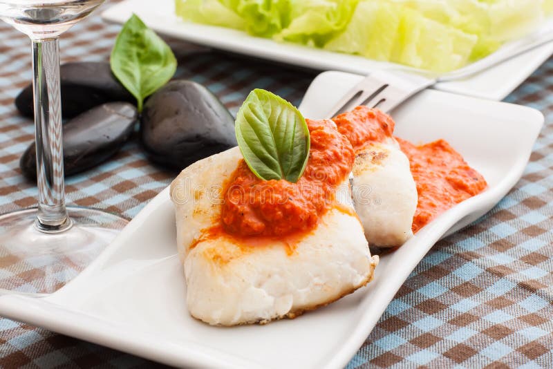 Fish on sauce stock photo. Image of pepper, cooked, food - 26793772