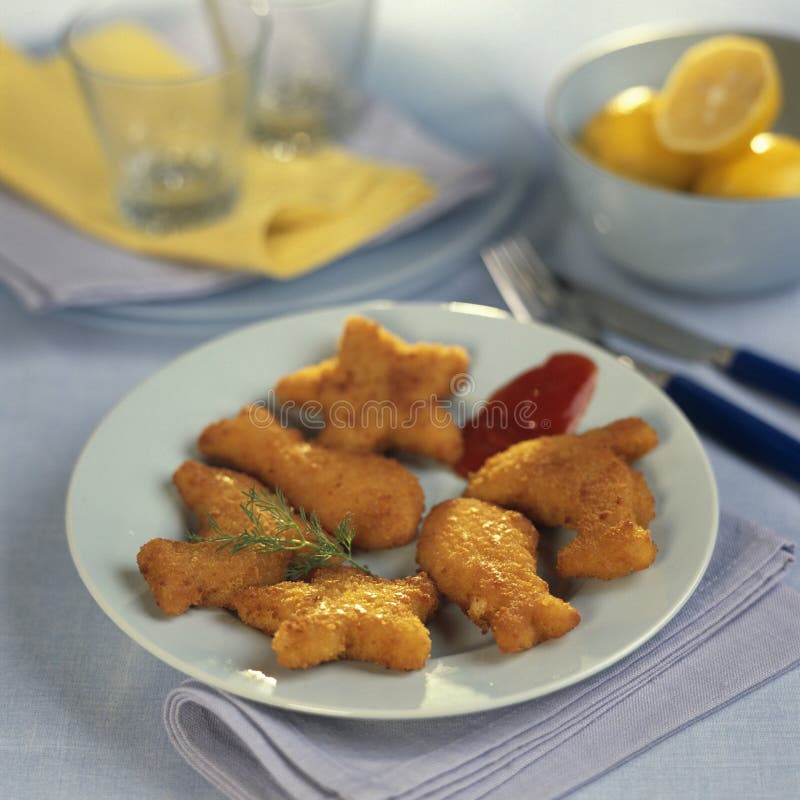 Fish-shaped fish fingers stock photo. Image of breaded - 23705564