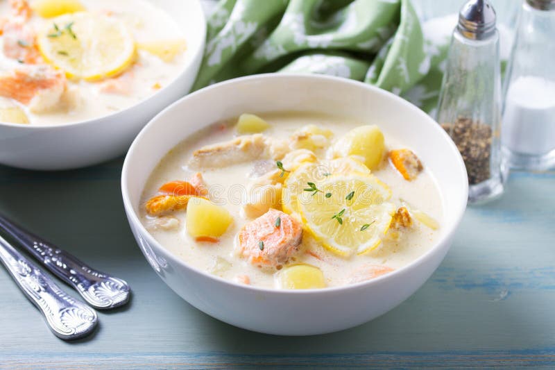 Fish and Shrimp Cream Soup in White Bowls on Blue Table. Stock Image ...