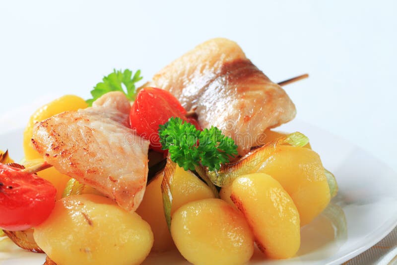 Fish skewer and potatoes stock image. Image of lunch - 23710359
