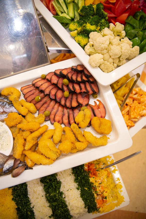 Fish Slicing and Various Dishes on the Buffet in the Restaurant Stock ...