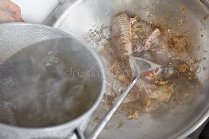 Fish stew stock photo. Image of spatula, kitchen, cook - 53520420