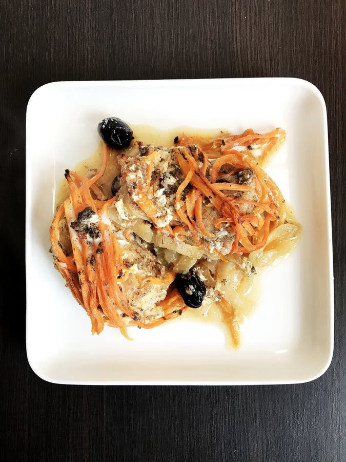 Fish Stewed with Vegetables and Spices in a White, Square Plate. Stock ...