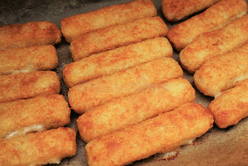 Crispy Baked Fish Sticks on a Baking Tray Stock Photo - Image of ...
