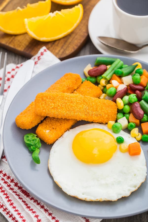 Fish Sticks, Fried Egg and Vegetables Stock Photo - Image of fish ...