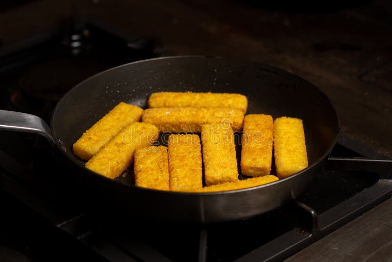 Fish Sticks in a Pan. Preparation of Frozen Fish Sticks Stock Image ...