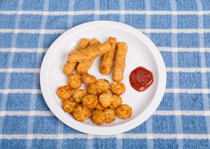 Fish Sticks and Potato Puffs on White Plate Stock Image - Image of ...