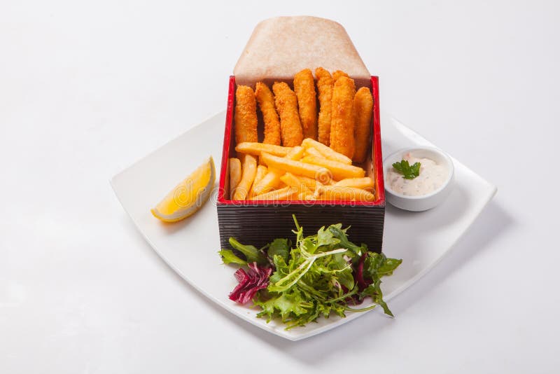 Fish Sticks in the Wooden Box with Sauce and Fried Potatoes Stock Image ...