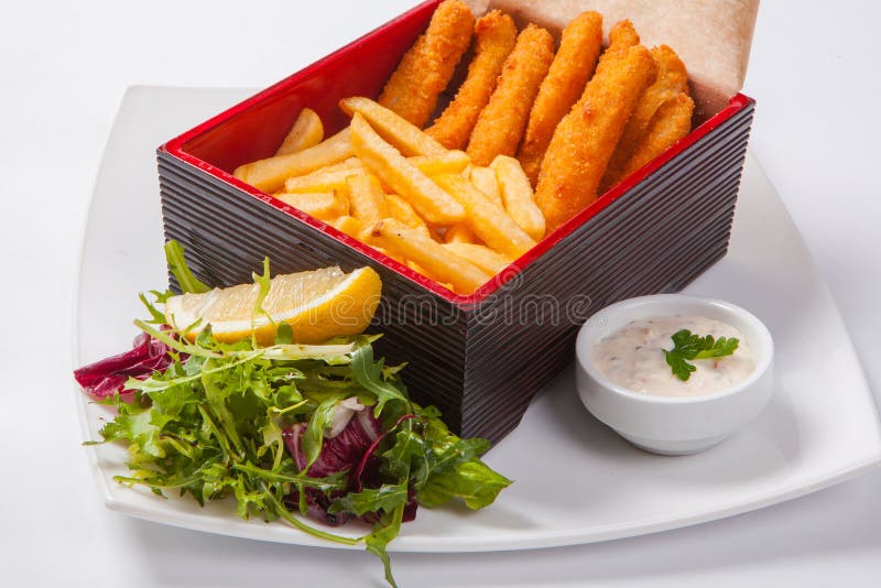 Fish Sticks in the Wooden Box with Sauce and Fried Potatoes Stock Image ...