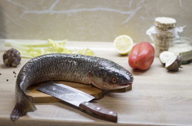 Fish. There is a Raw Fish Cut into Pieces on the Kitchen Board Stock ...