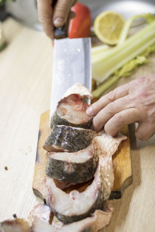 Fish. There is a Raw Fish Cut into Pieces on the Kitchen Board Stock ...