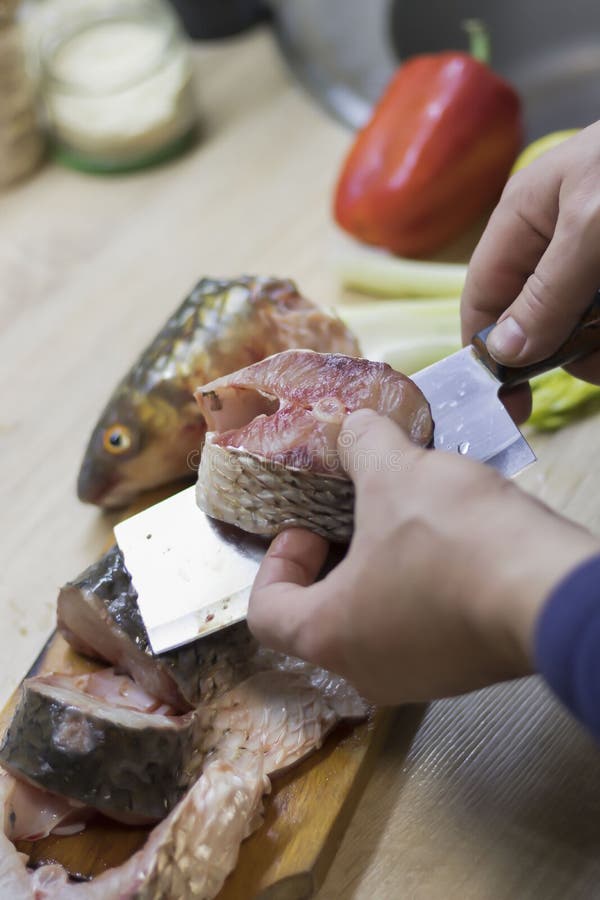 Fish. There is a Raw Fish Cut into Pieces on the Kitchen Board Stock ...