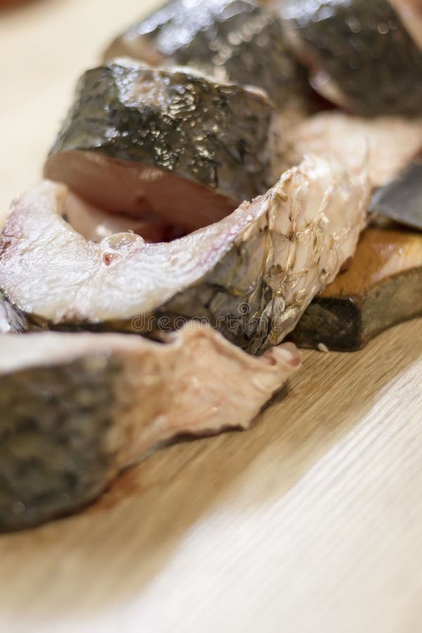 Fish. There is a Raw Fish Cut into Pieces on the Kitchen Board Stock ...